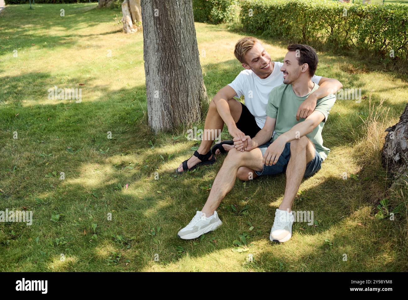 Two joyful men enjoy each others company, sharing laughter and ...