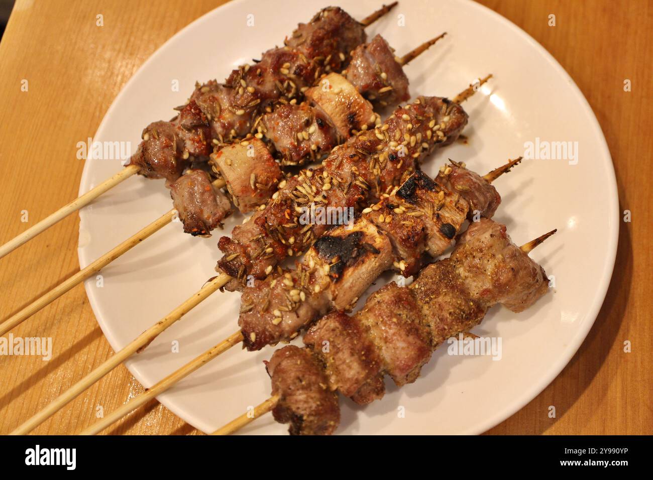 Northeastern Chinese cuisine: grilled lamb skewers with cumin seeds ...