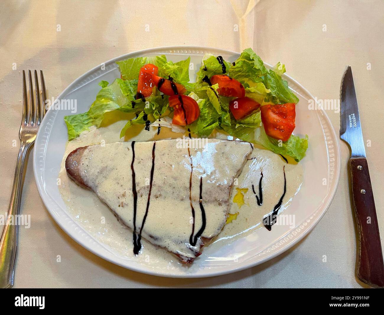 Tuna loin with cream and salad. Spain Stock Photo - Alamy
