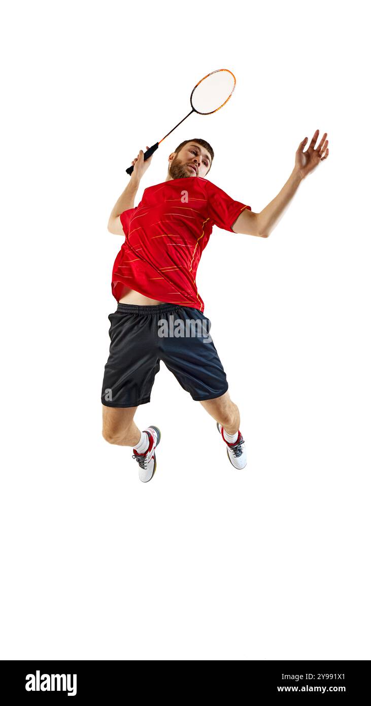 Badminton player in mid-air, ready smash shuttlecock across court. Raw ...