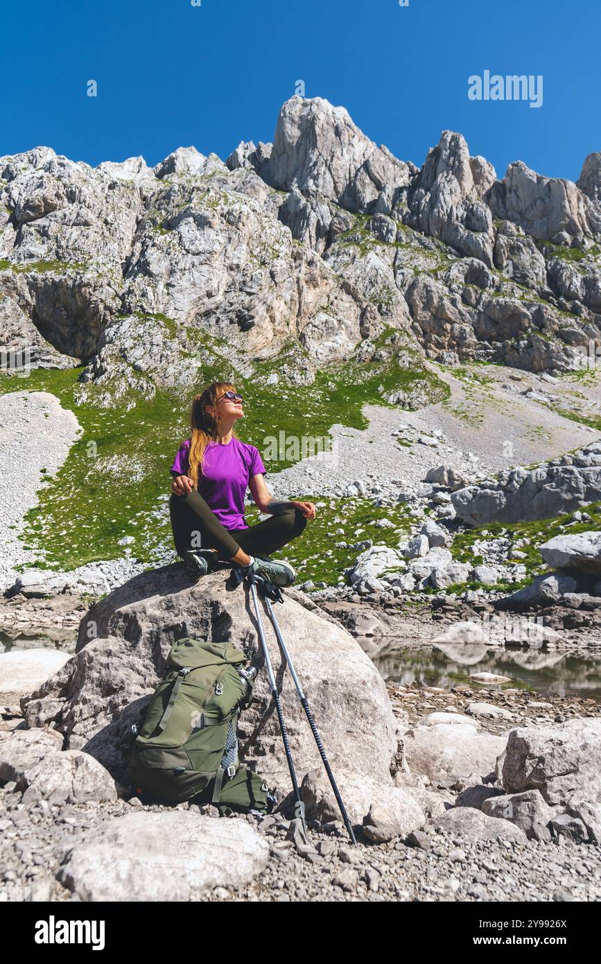 Female Solo Hiker Resting Sitting on Rock Stock Photo - Alamy