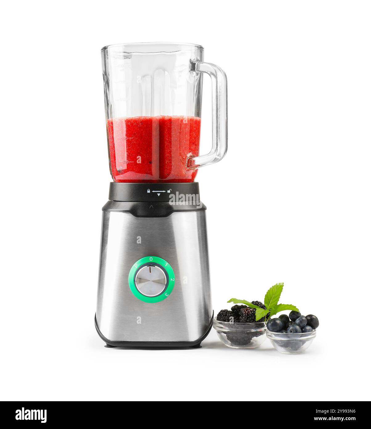 Blender with mixture of ingredients and fresh berries isolated on white ...