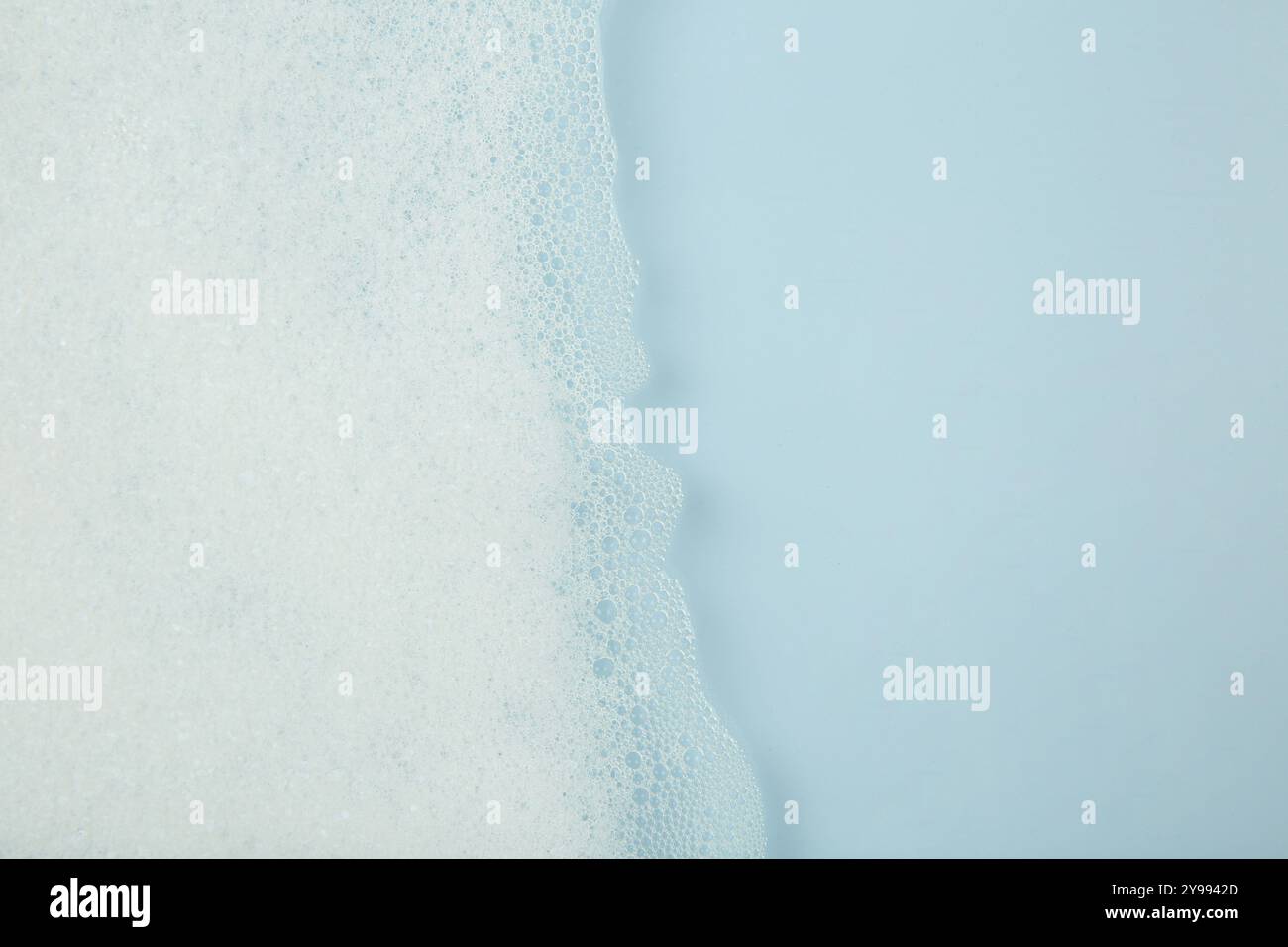 Washing laundry. Water with foam, top view Stock Photo - Alamy