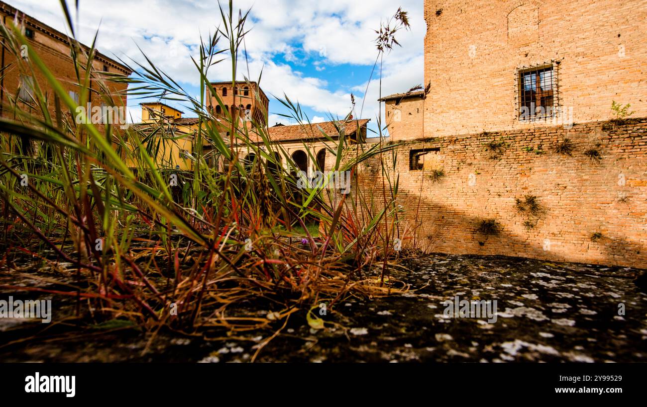 view of a medieval castle in Italy with the blue sky the crenellated ...