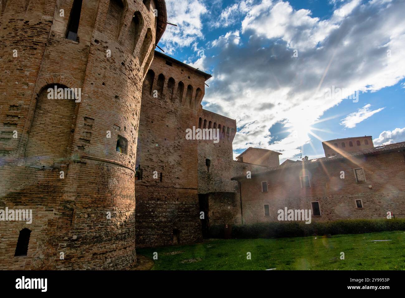 view of a medieval castle in Italy with the blue sky the crenellated ...