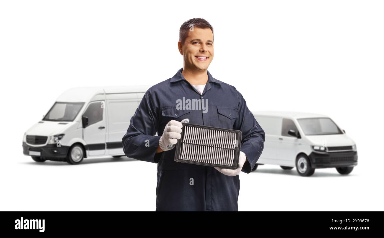 Auto mechanic holding an air filter for a van isolated on white ...