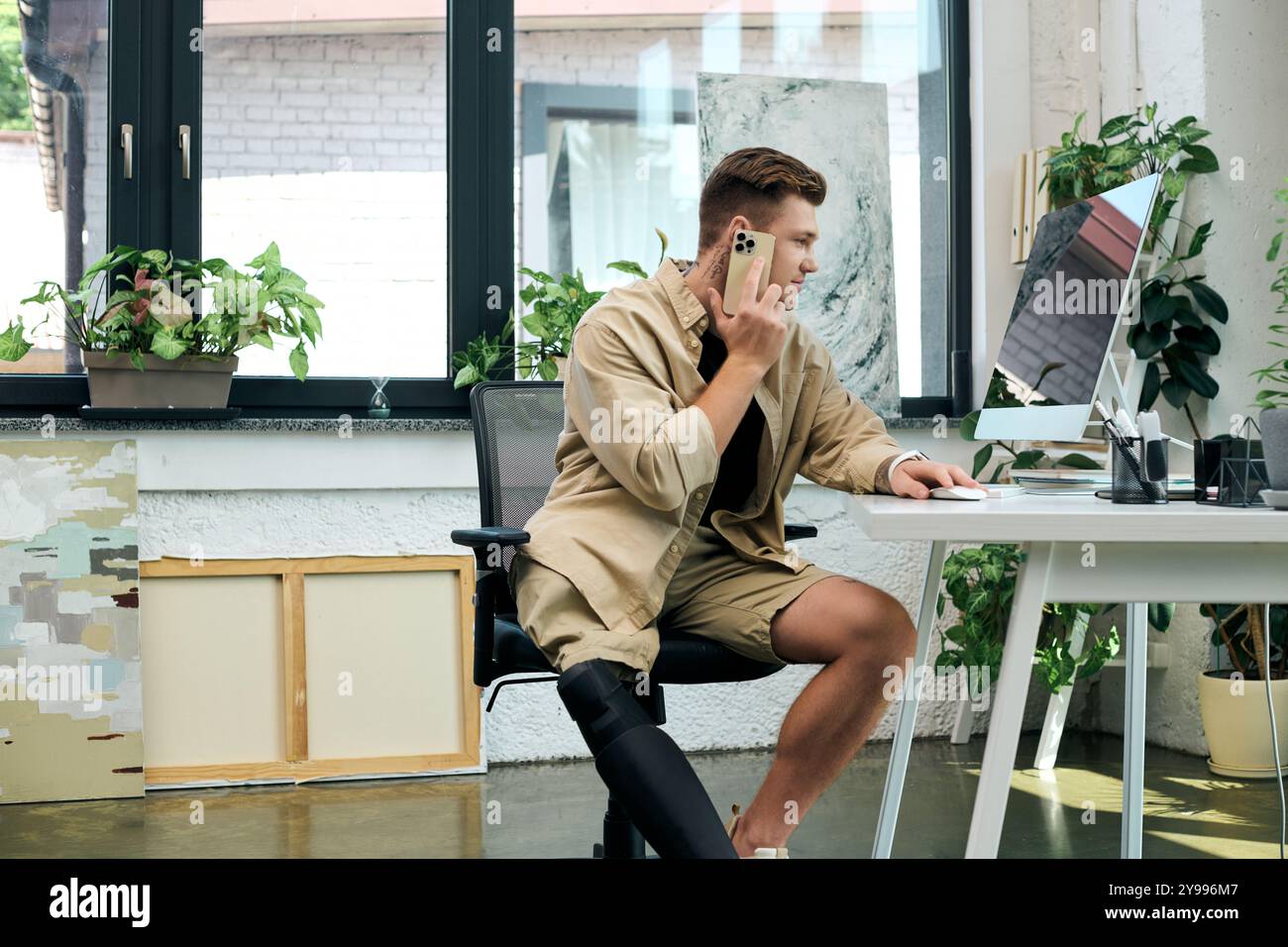 A dedicated young professional with a prosthetic leg collaborates in a ...