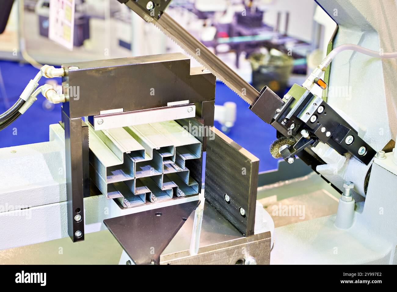 Electrohydraulic automatic band sawing machine Stock Photo - Alamy