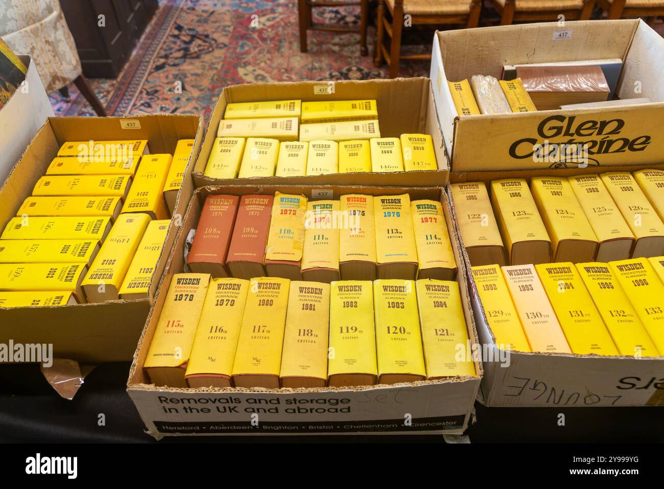 Boxes of Wisden Cricket almanack books on display in auction sale room ...