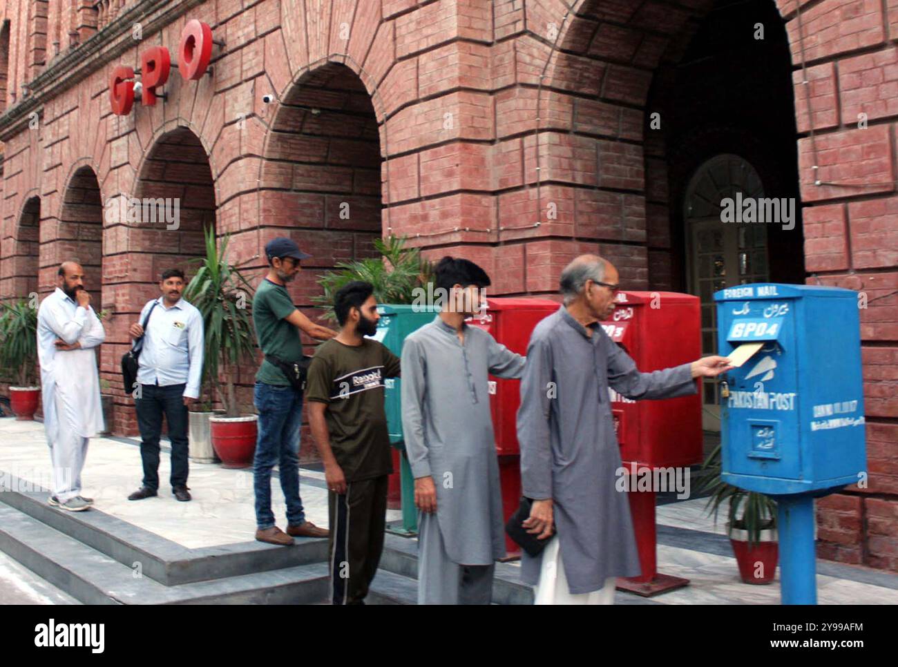 People are putting letters in a post booth at General Post Office (GPO ...