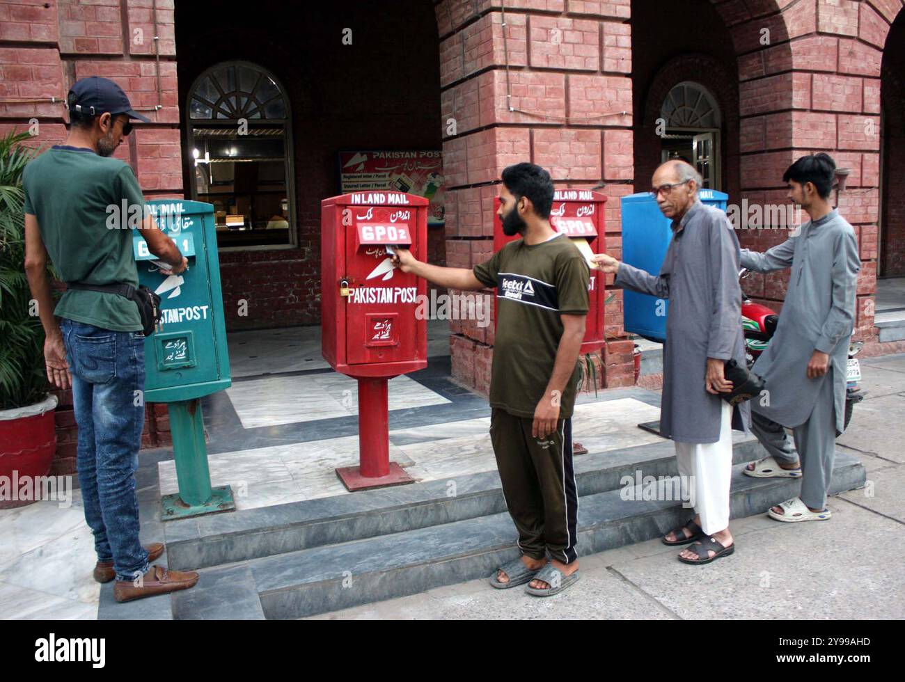 People are putting letters in a post booth at General Post Office (GPO ...