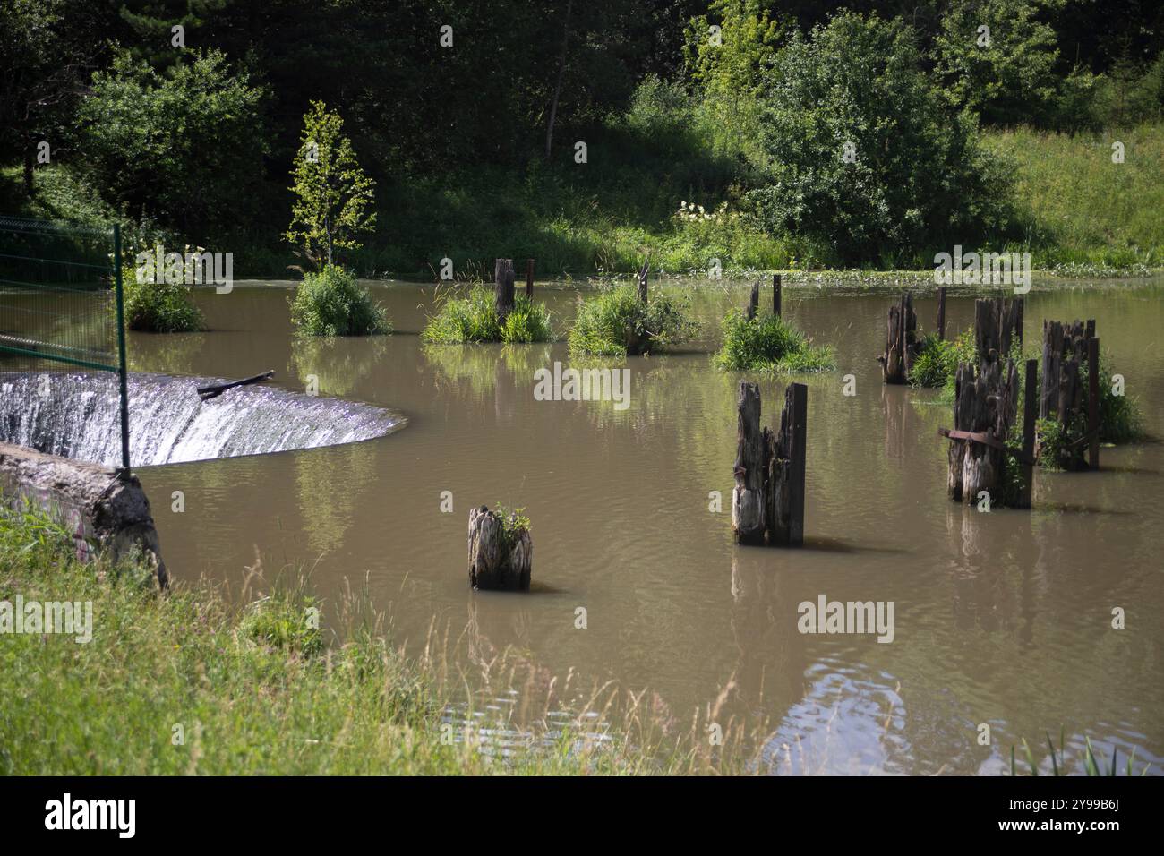 A dam on a river. Drainage of water. Drainage structure. Water flow ...