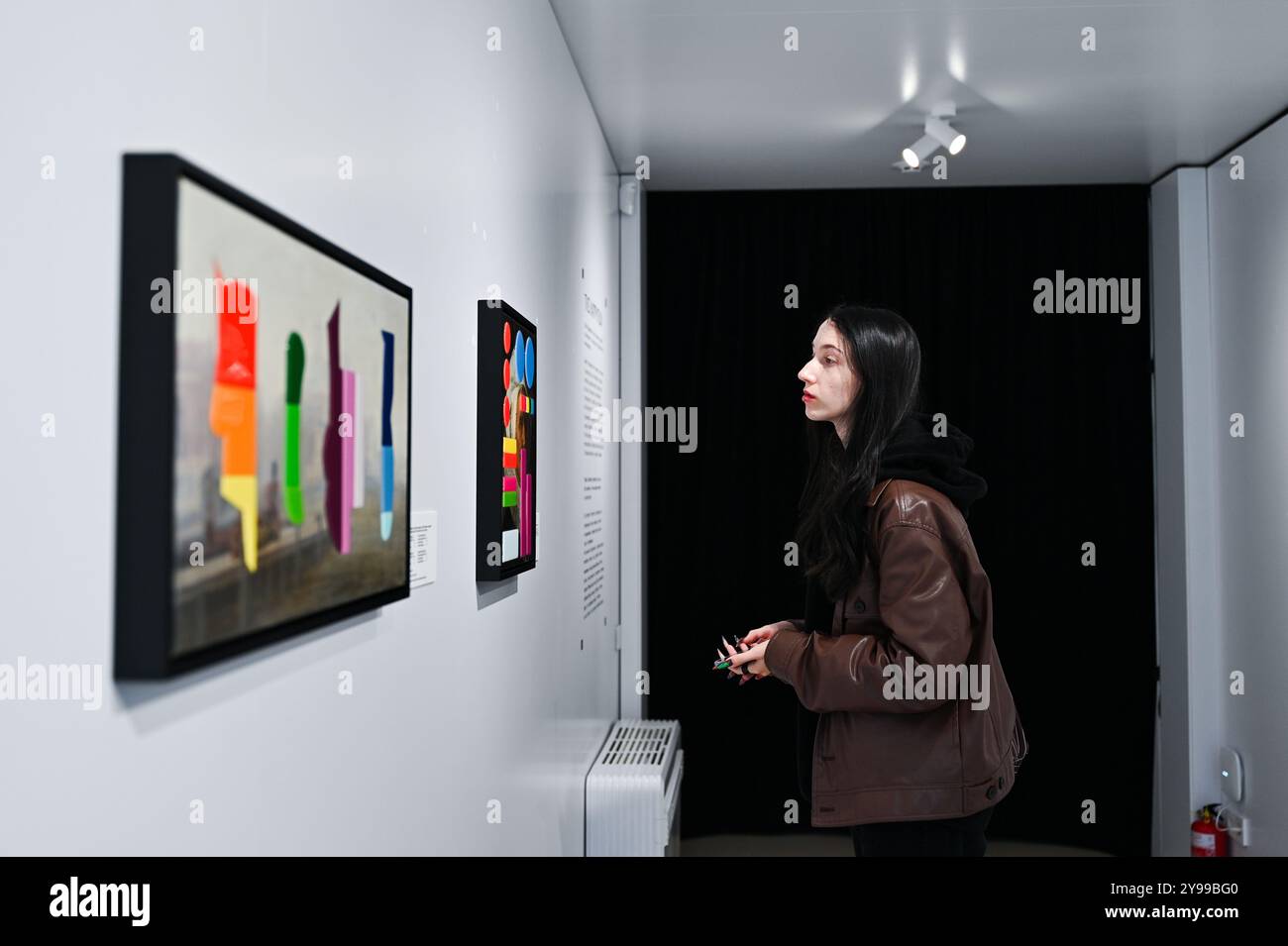 LVIV, UKRAINE - OCTOBER 4, 2024 - A visitor looks at an artwork by ...