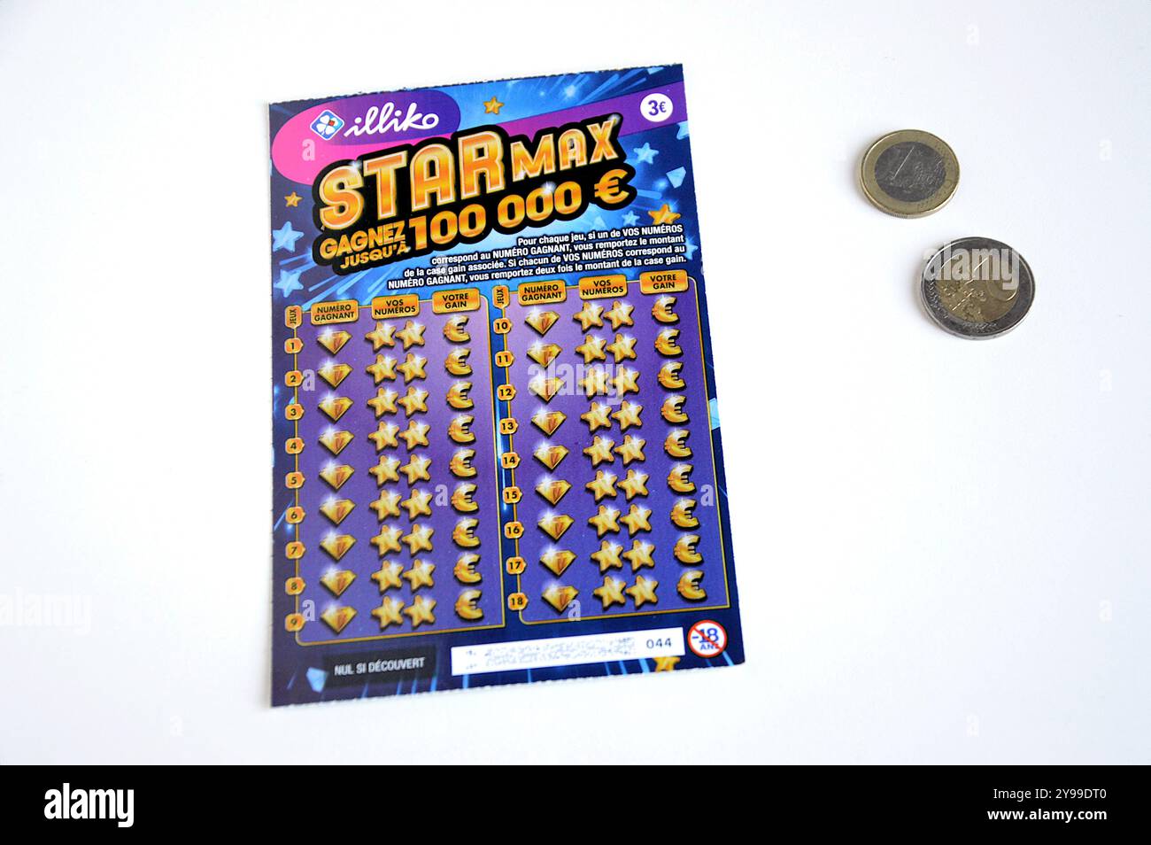In this photo illustration, a Star Max scratch card next to euro coins ...