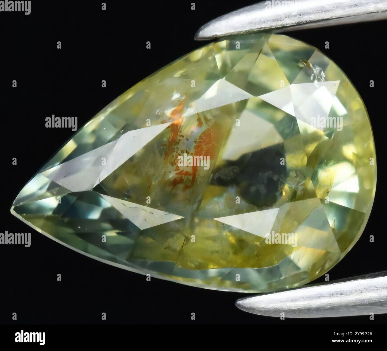 Radiant Yellow-Green Pear-Shaped Gemstone Capturing Light and Intrigue ...