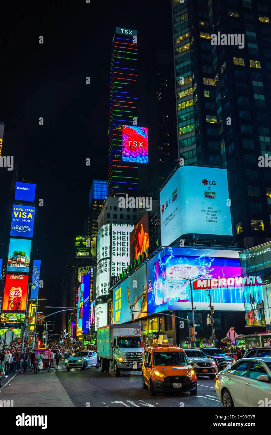 Night view of Times Square with brightly lit billboards for LG, TSX ...