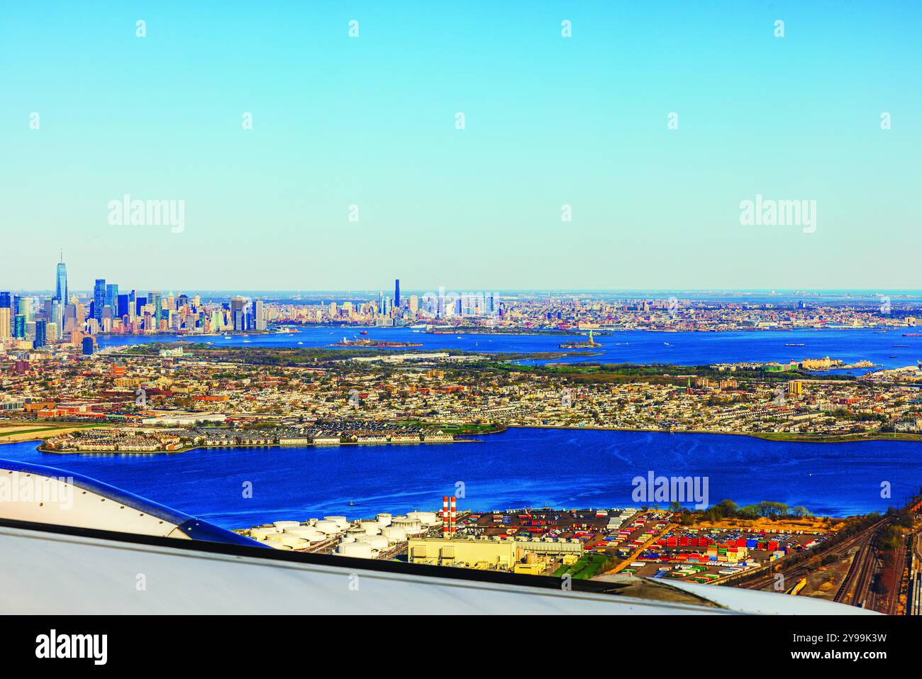 Aerial view from airplane window during takeoff, showing New York City ...