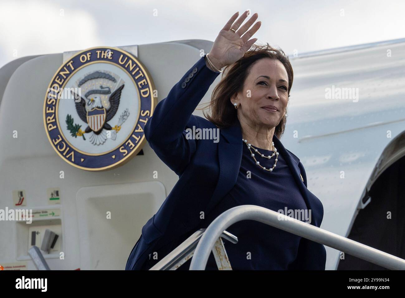Vice President Kamala Harris waves as she boards Air Force Two at ...