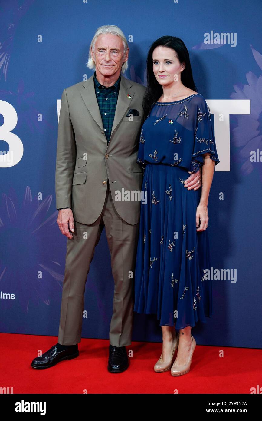 Paul Weller and Hannah Weller pose for photographers upon arrival at ...