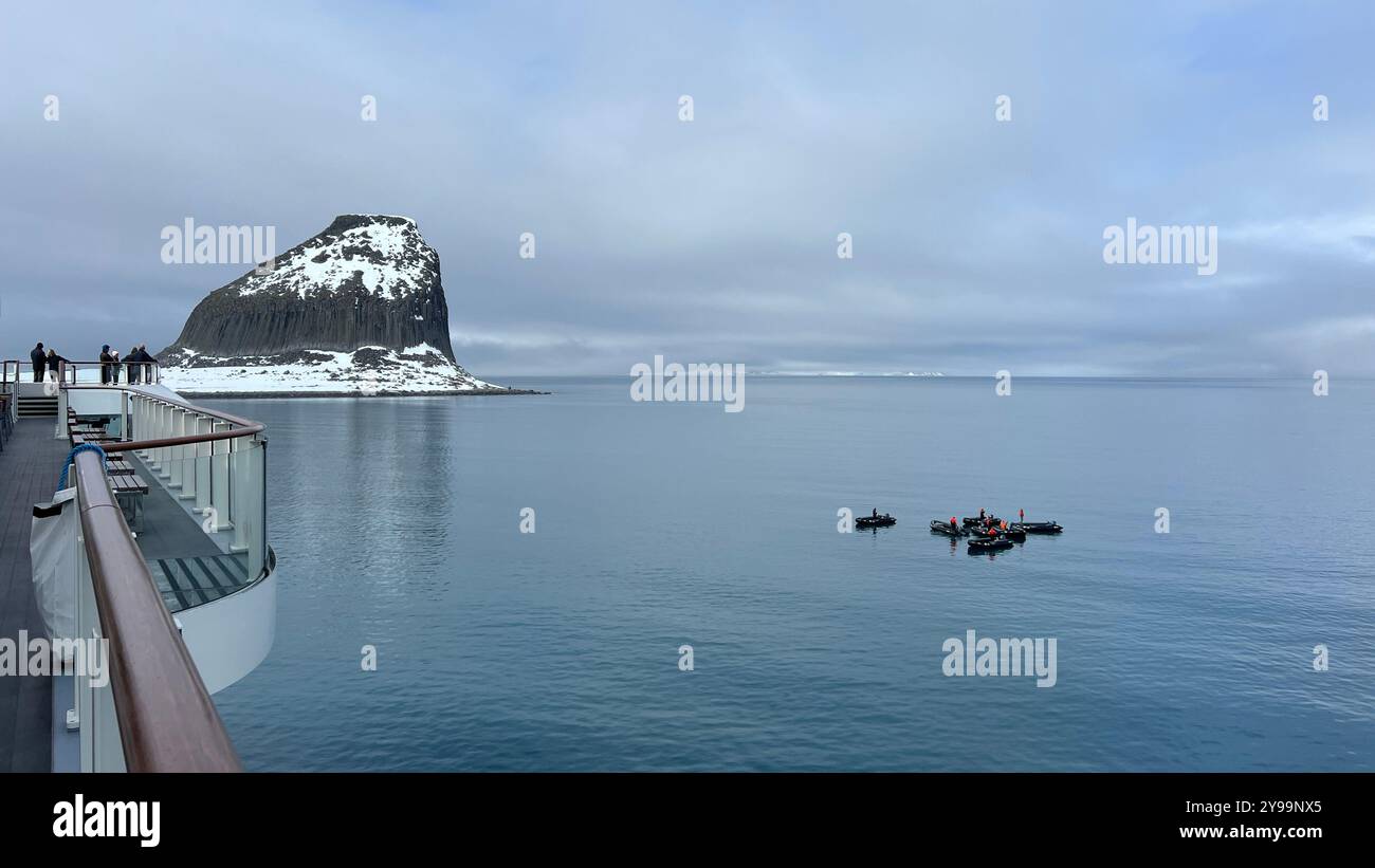 Passengers aboard the Lindblad Nat Geo Endurance observe Edinburgh Rock ...