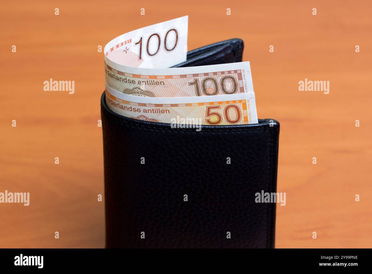 Netherlands Antillean money - guilder in the black wallet Stock Photo ...