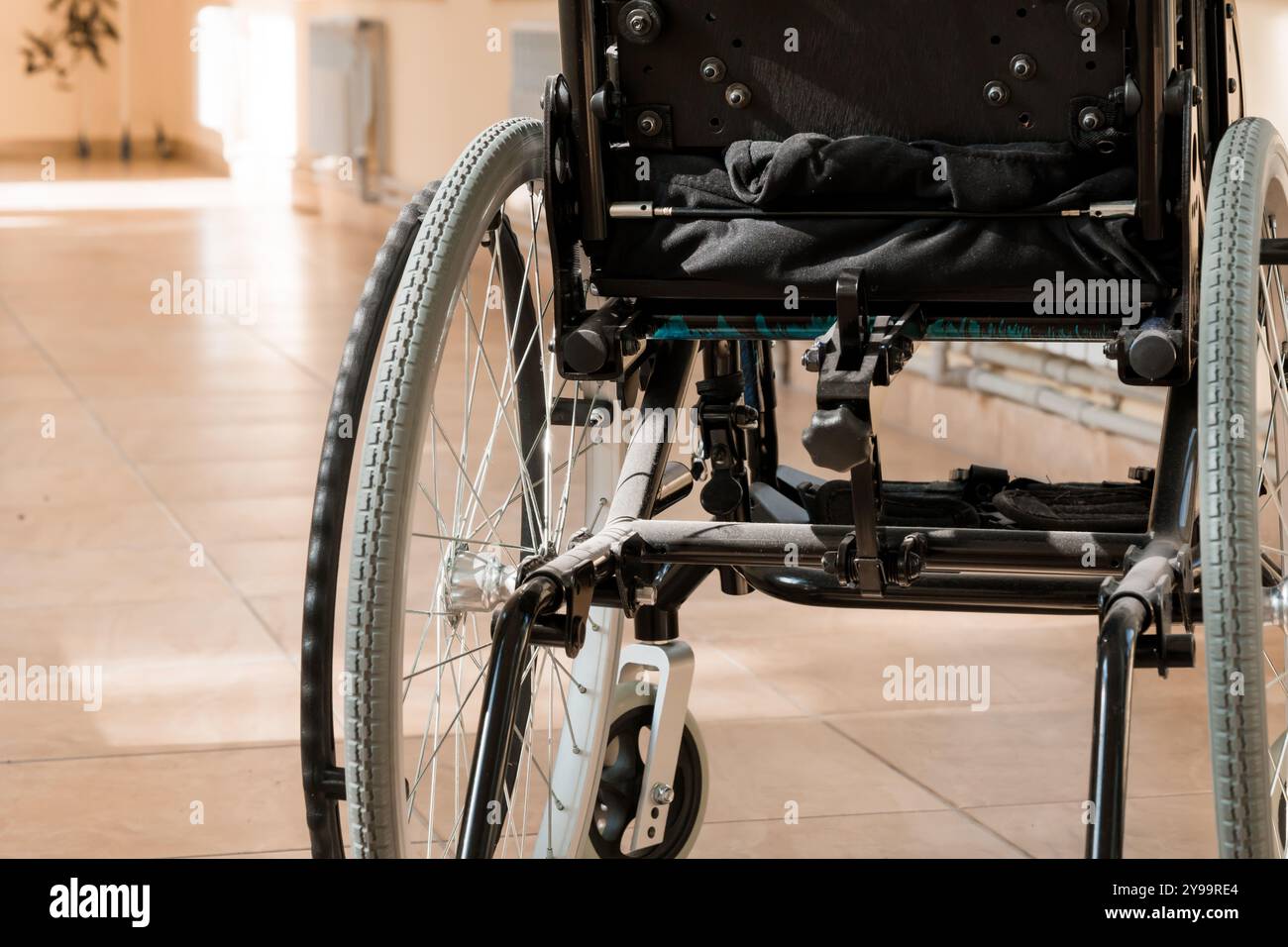 A Thoughtful Perspective on a Wheelchair in a Spacious Indoor ...