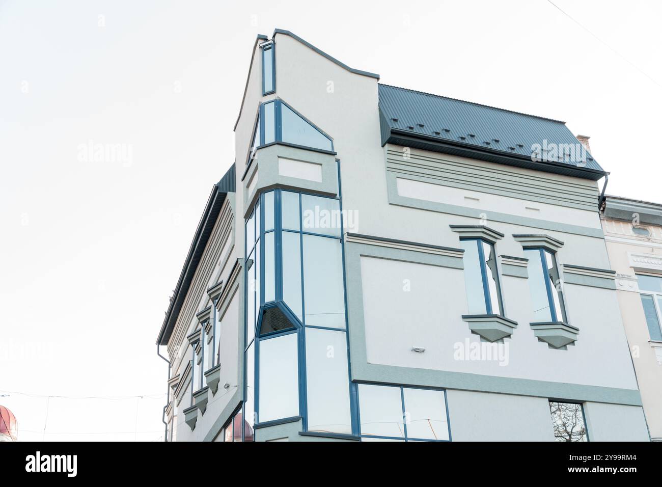 Modern Architectural Marvel Featuring Striking Angled Facade and Glass ...