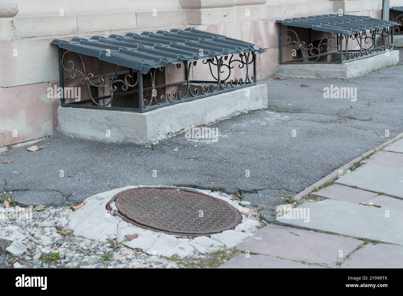 Decorative Grate Over a Basement Window on a Paved Streetside Stock ...