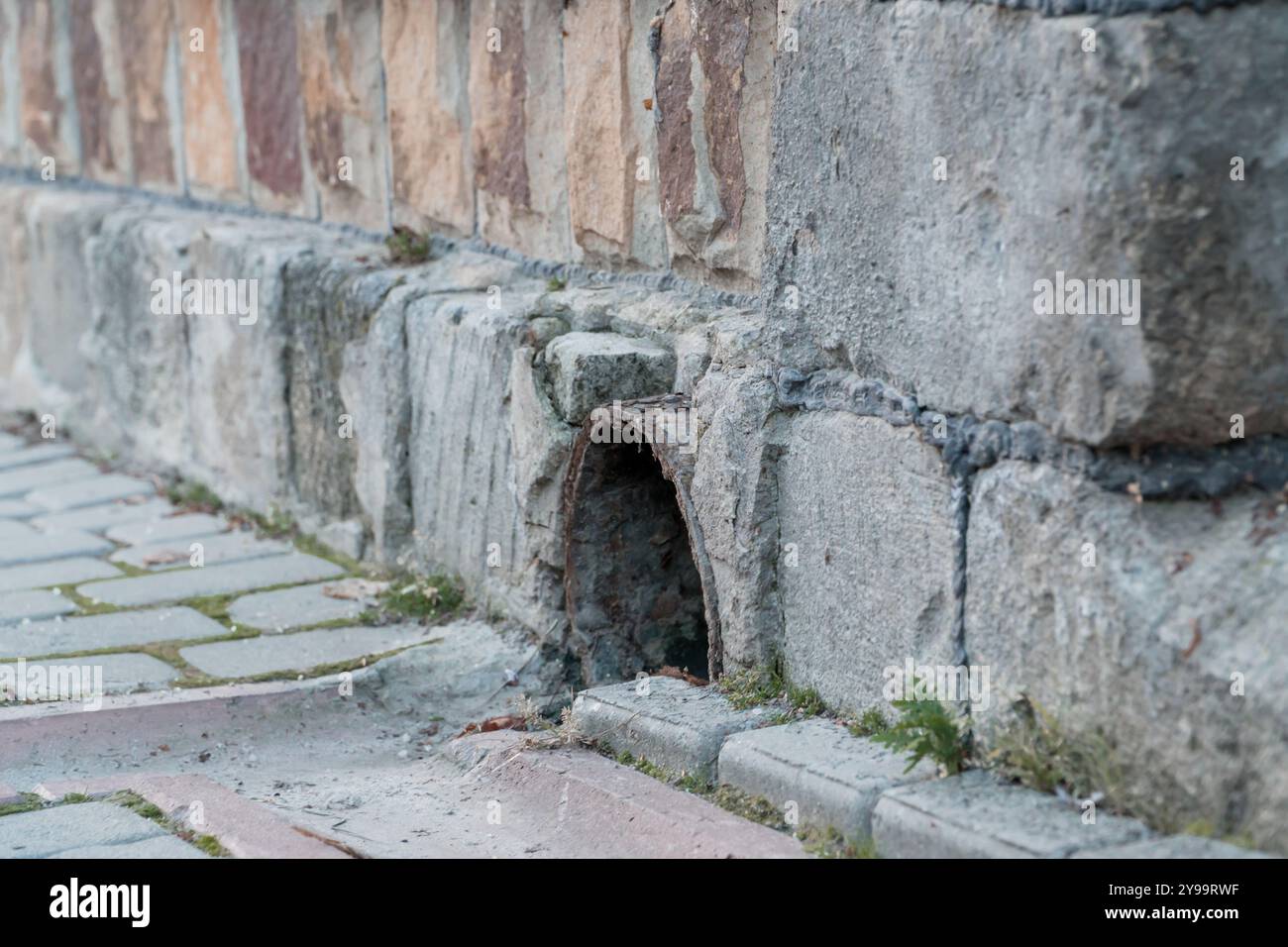 Rustic Stonework with an Arched Passageway and Cobblestone Pathway ...