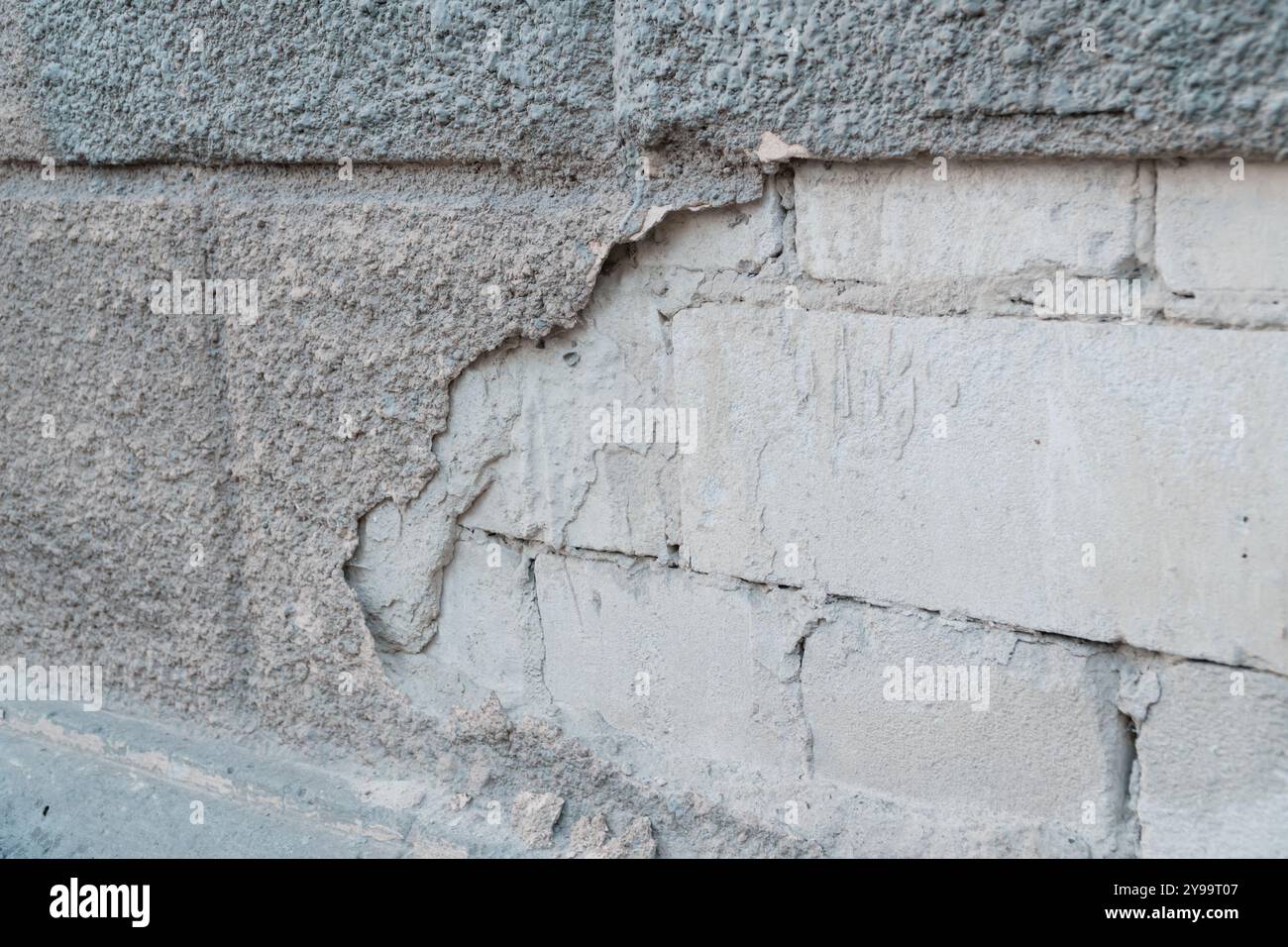 Crumbling Texture of an Aged Concrete Wall with Exposed Bricks and ...