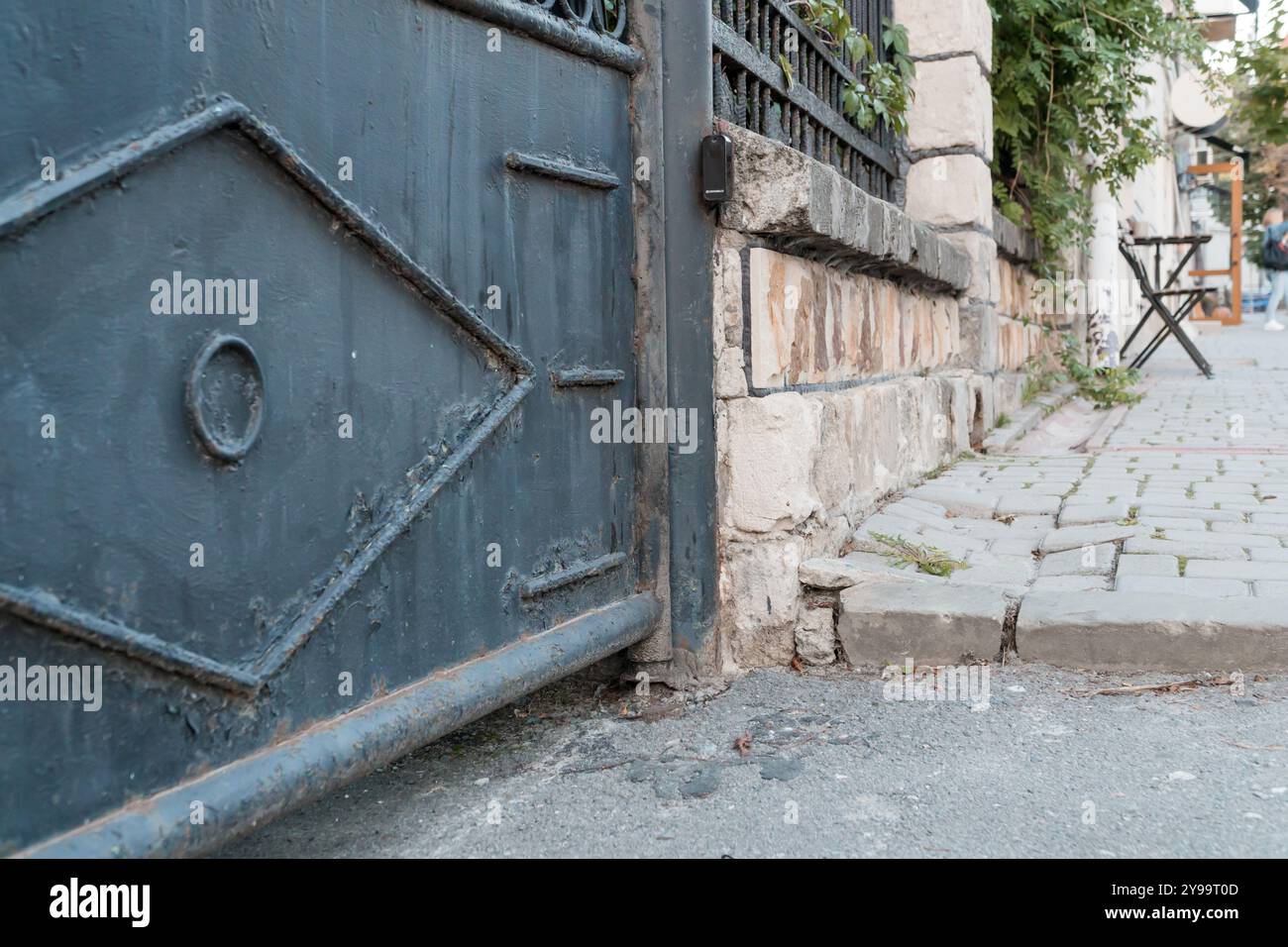 Rustic Blue Gate with Stone Pathway and Charming Street View Stock ...