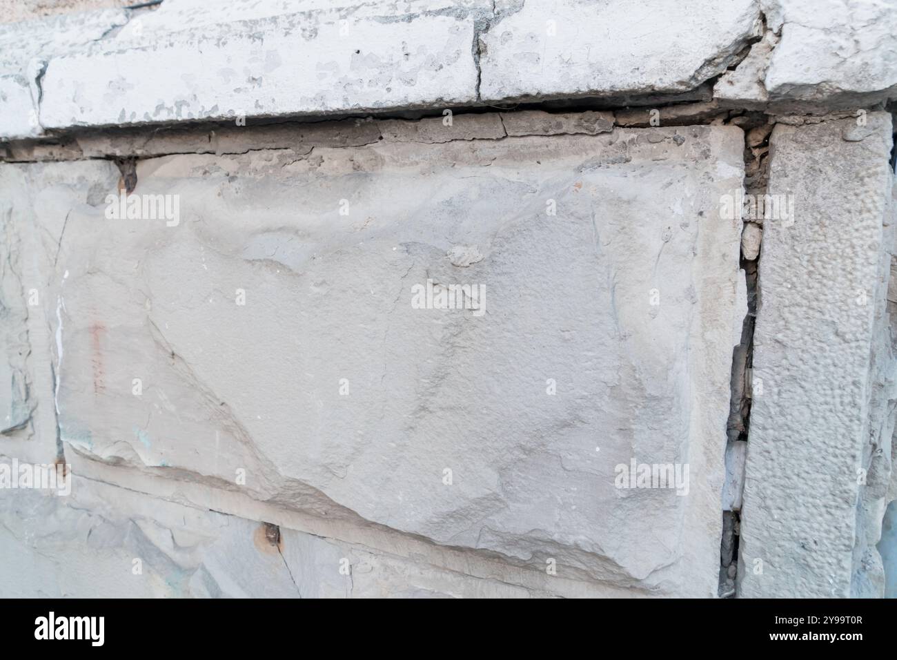 Textured Stone Wall with Cracks and Erosion Effects in Soft Natural ...