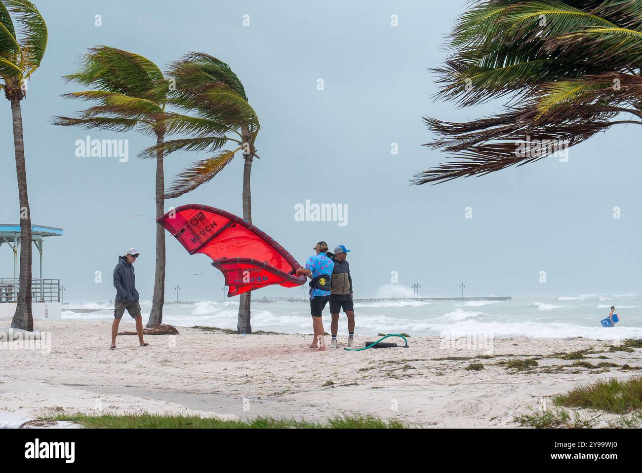 A kite surfer prepares his rig at Higgs Beach ahead of Hurricane Milton ...