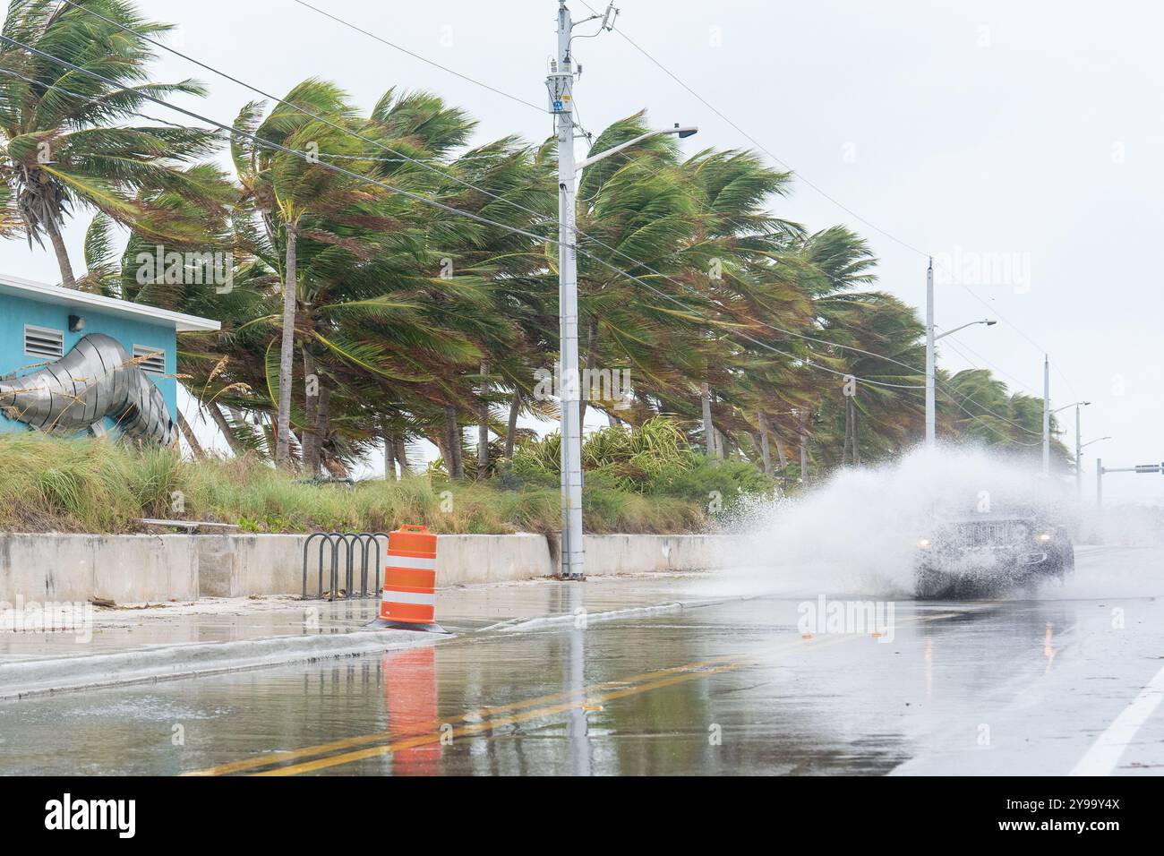 Key West, USA. 9th Oct, 2024. A Jeep drives through floodwaters near ...