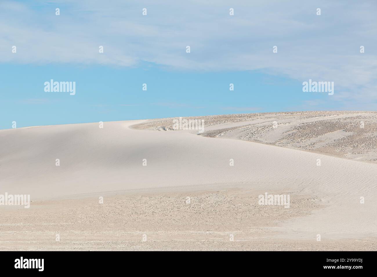 Drifting white sand and blue sky with clouds at White Sands National ...
