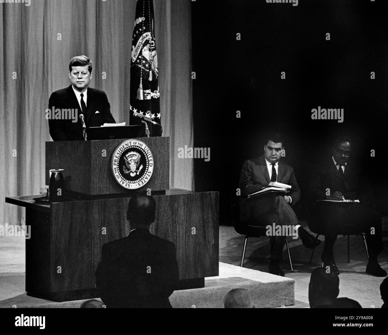U.S. President John F. Kennedy at lectern during press conference ...