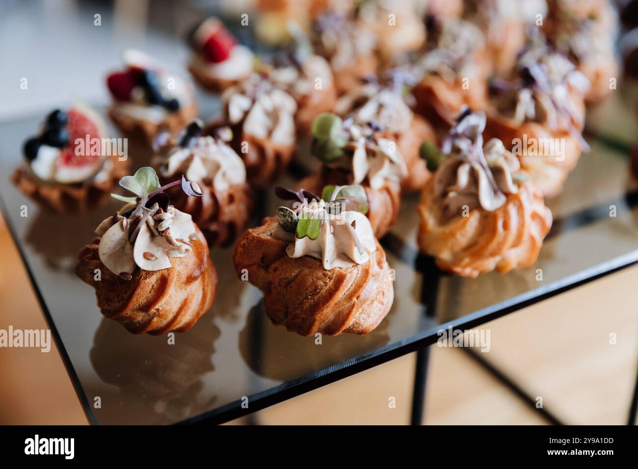 Gourmet chocolate desserts and savory prosciutto appetizers displayed ...
