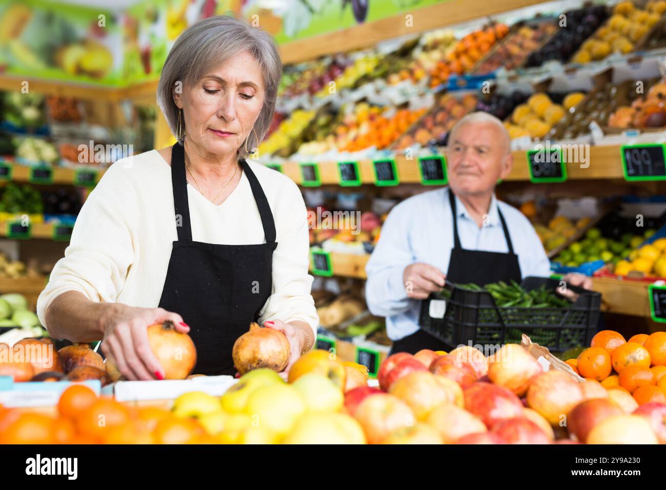 Older worker supermarket hi-res stock photography and images - Alamy