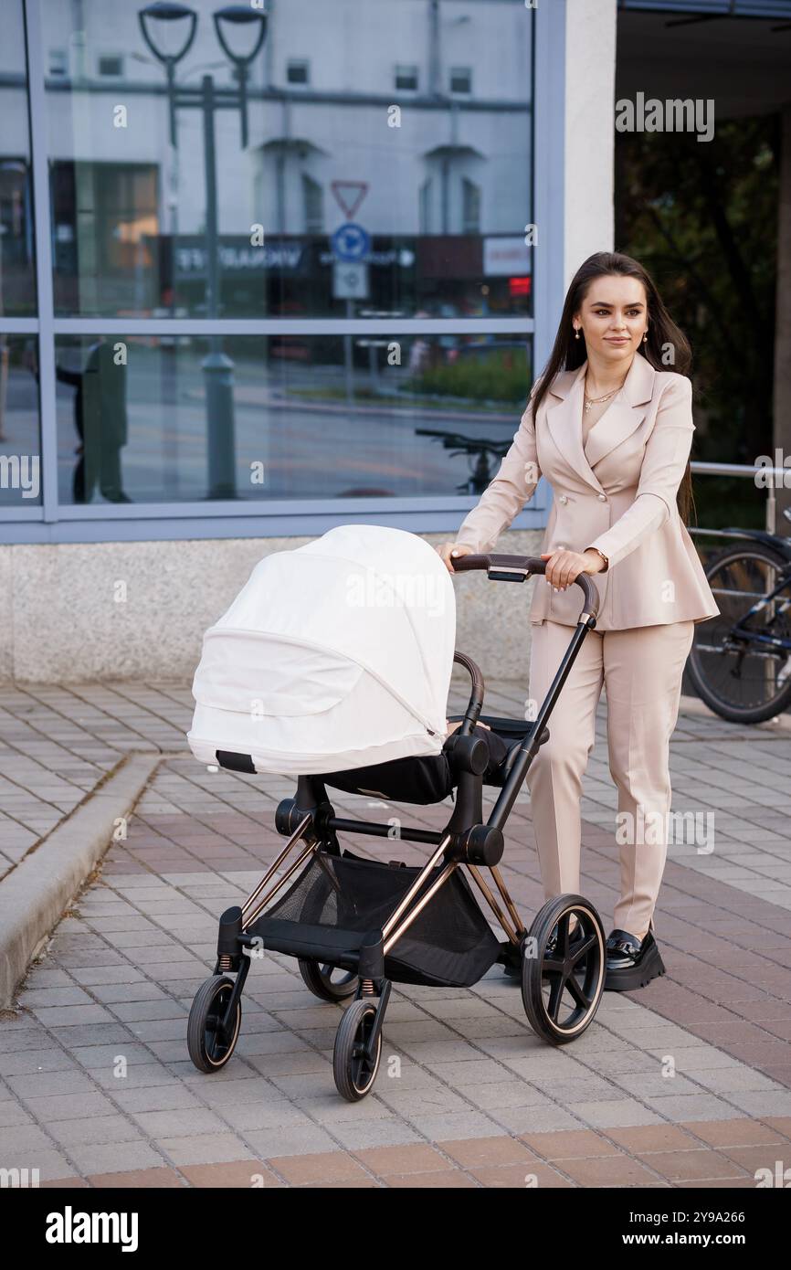 Stylish Young Mother Pushing a Modern Stroller in Urban Setting Stock ...