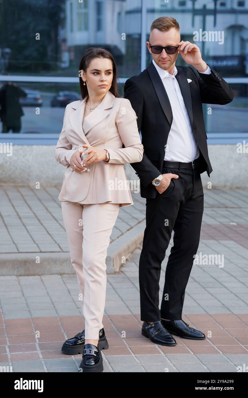 Stylish Young Couple in Elegant Attire Outside a Modern Building Stock ...
