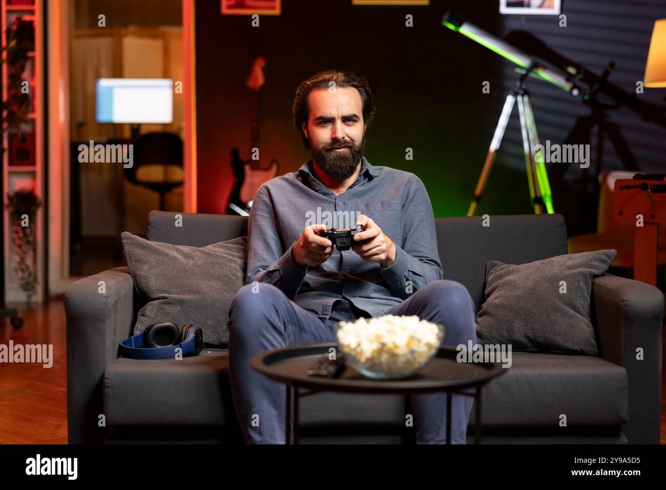 Portrait of man playing boring videogame on gaming console, feeling ...