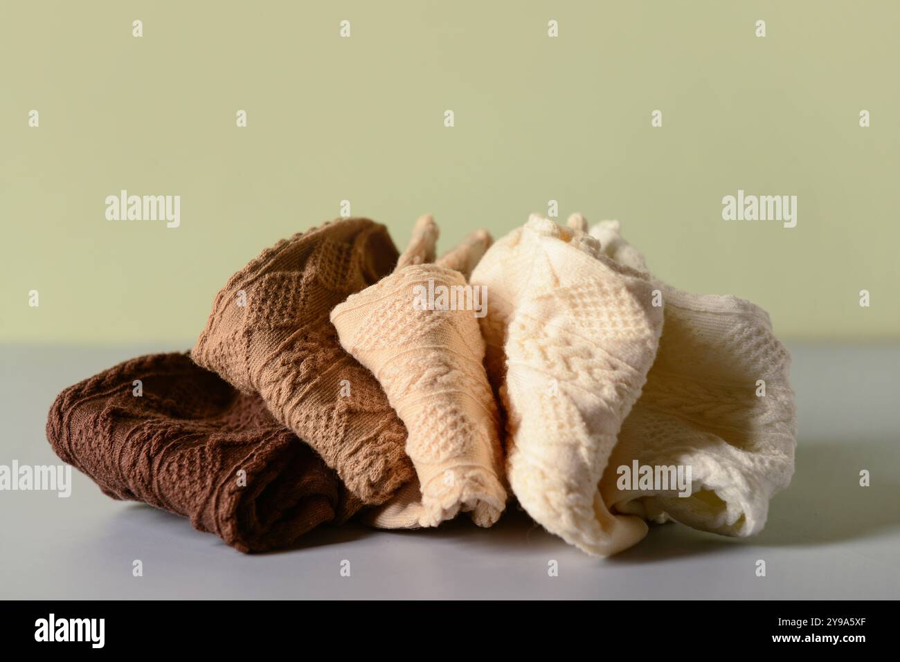 Basic color socks on grey table Stock Photo - Alamy