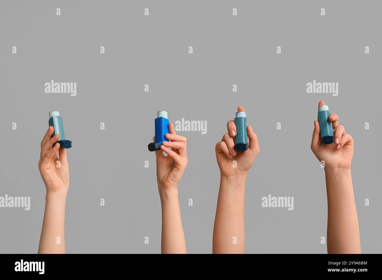 Female hands with modern asthma inhalers on grey background Stock Photo ...