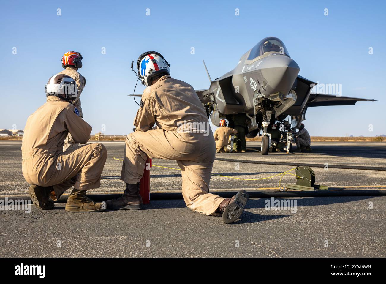 U.S. Marines assigned to Marine Aviation Weapons Squadron One, load ...