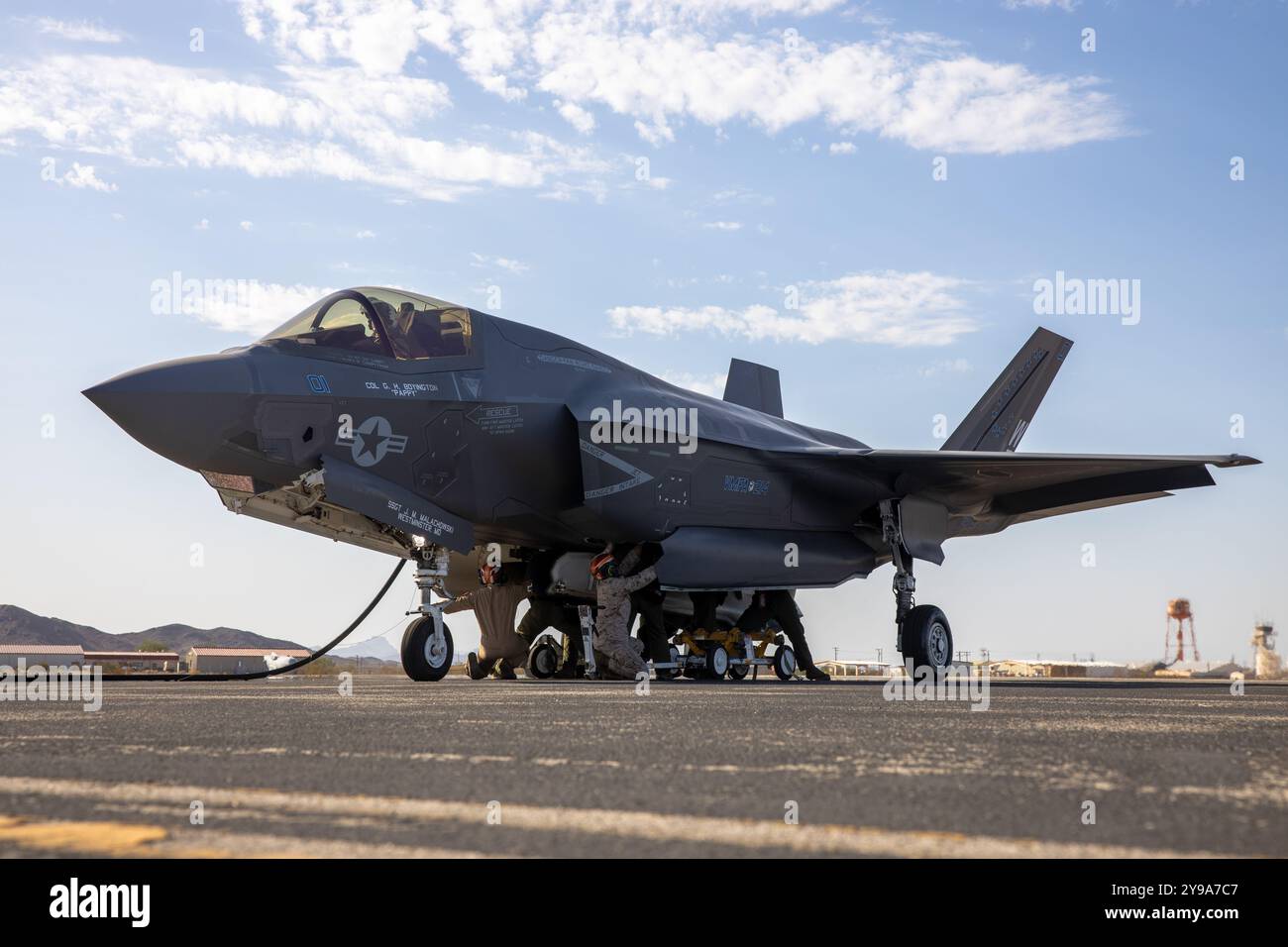 U.S. Marines assigned to Marine Aviation Weapons Squadron One, load ...