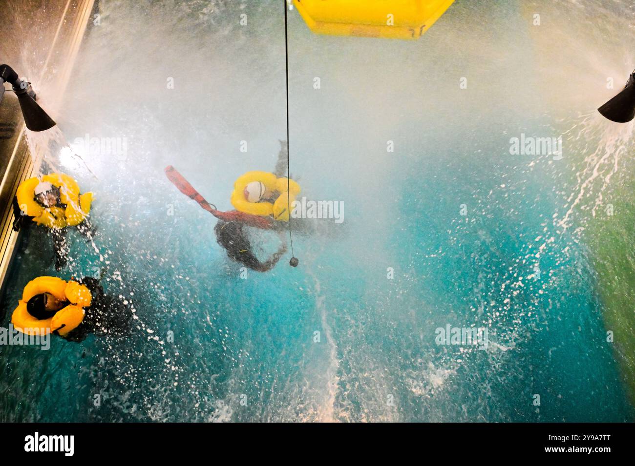 A U.S. Naval Sea Cadet gives a thumbs up after being hoisted from the ...