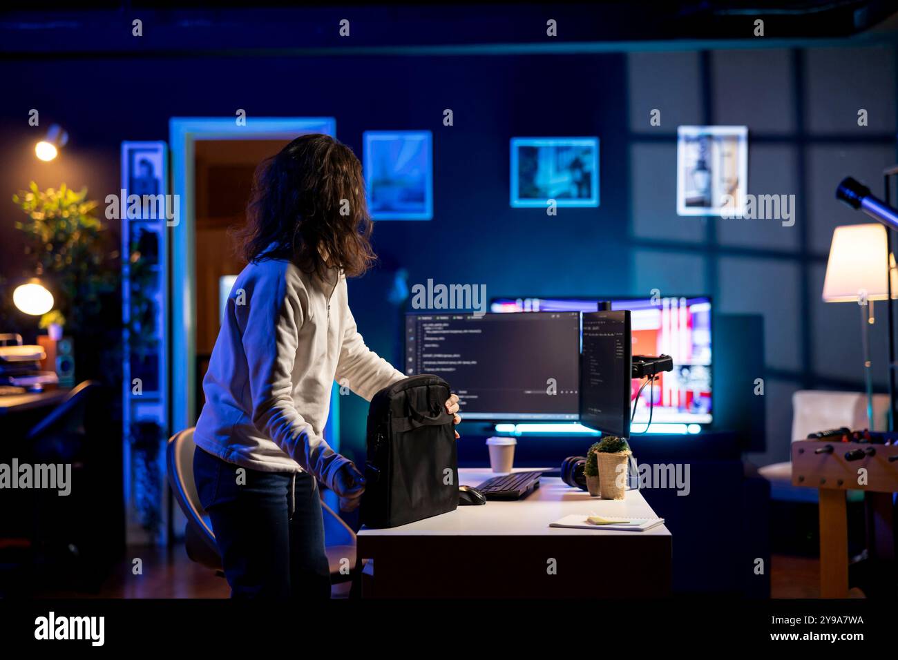 Woman leaving office after finishing hi-res stock photography and ...