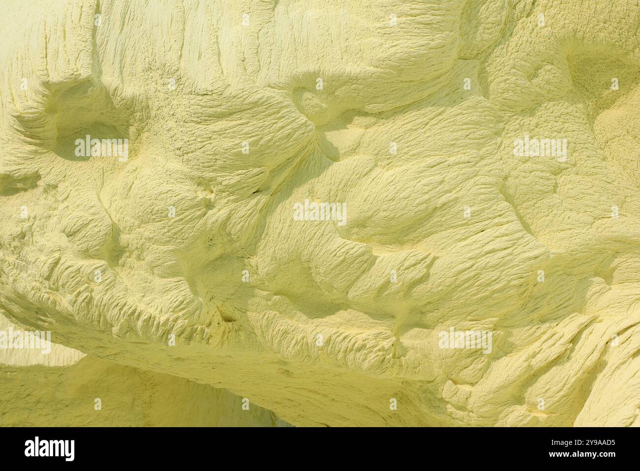 Sulfur stone texture in Ijen crater Stock Photo - Alamy
