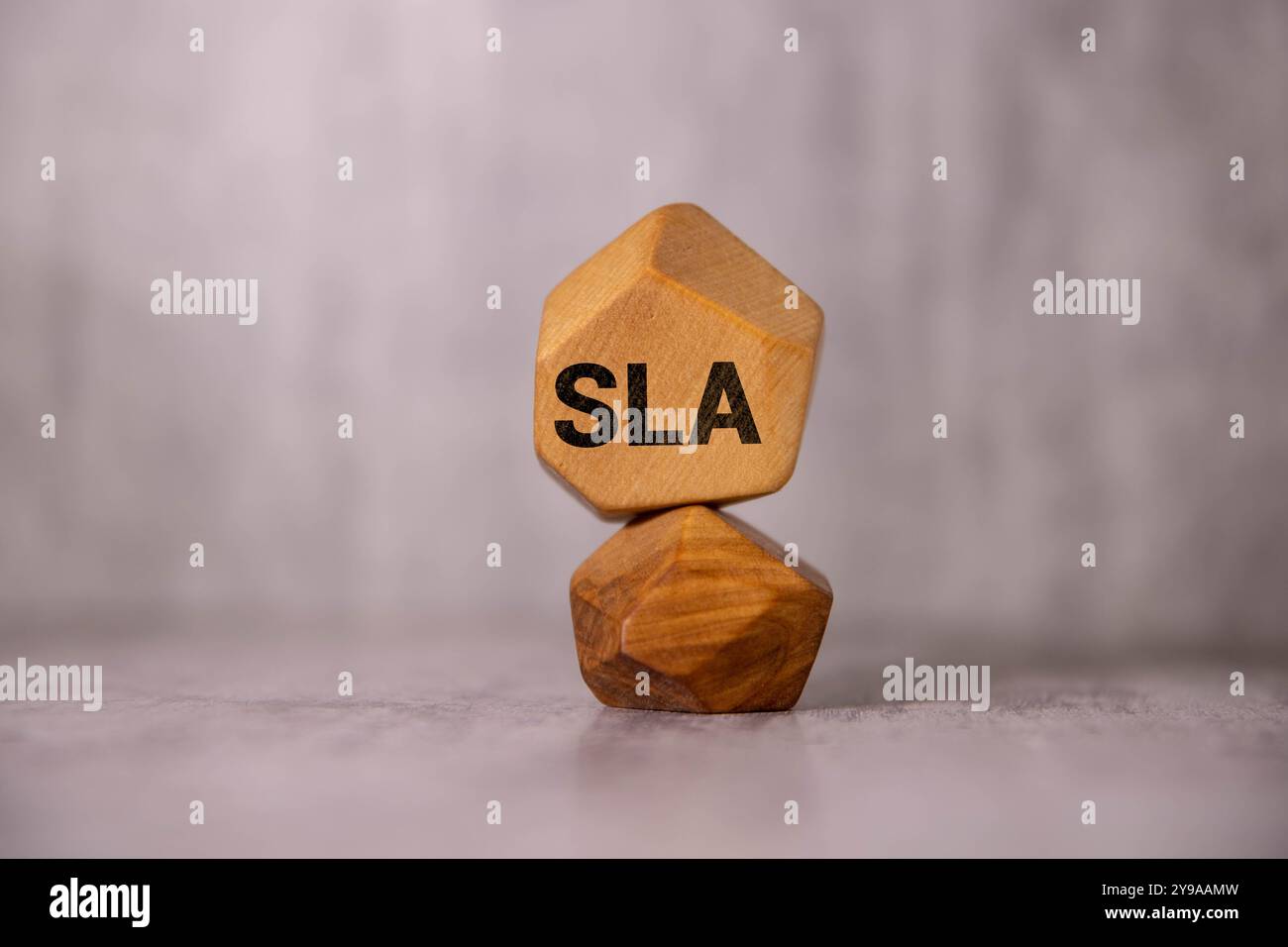 text SLA on wooden cubes on office table with copy space, representing ...