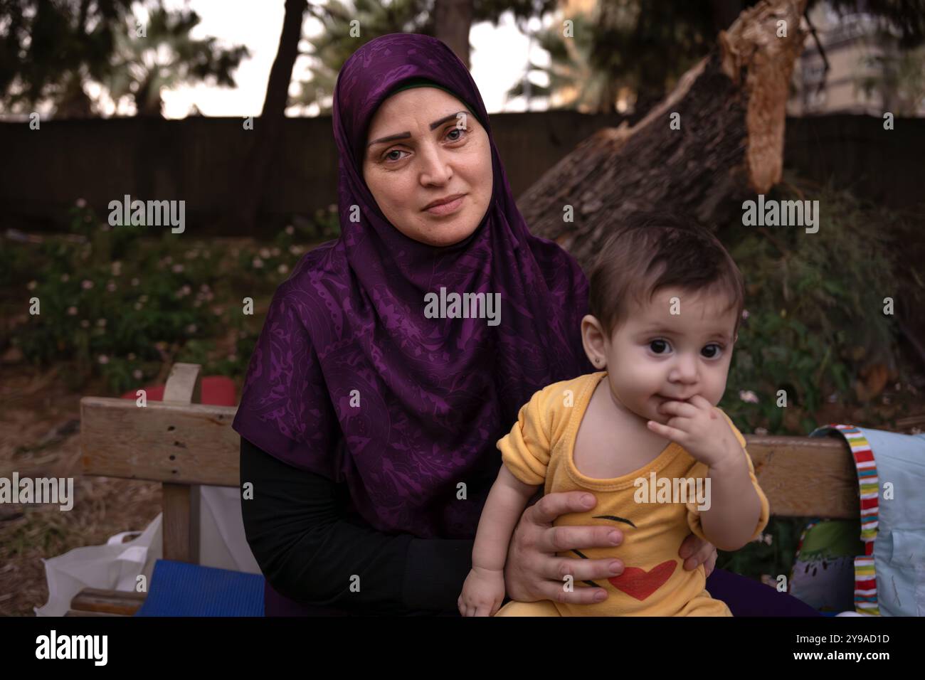 Tripoli, Lebanon. 09th Oct, 2024. Alaa Akel and her baby boy seen ...
